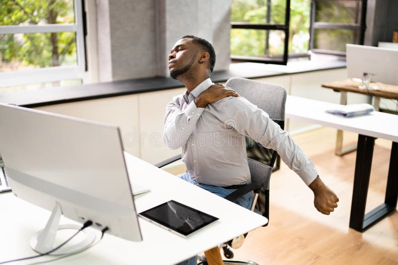Employee Stretching at Office Desk Stock Image - Image of caucasian ...