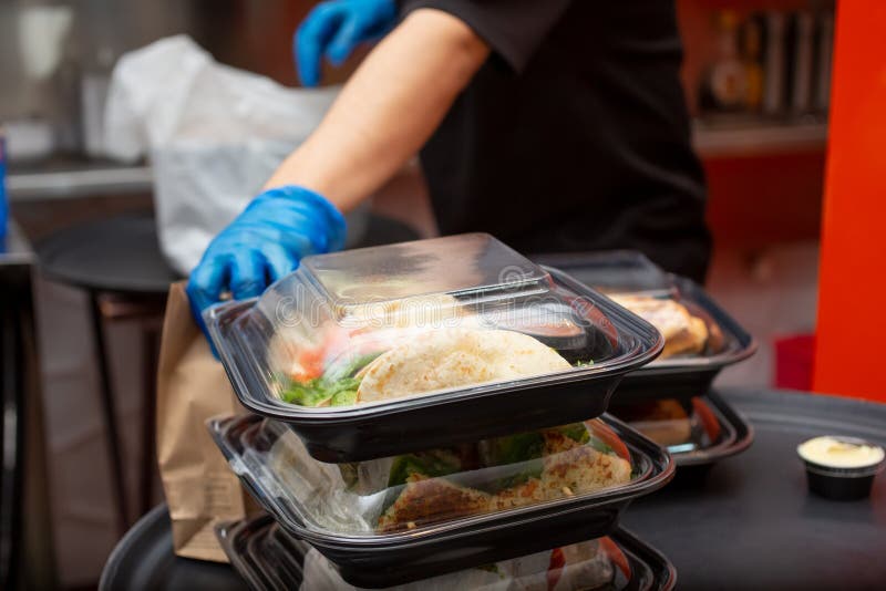 Employee and To Go Containers Stock Photo - Image of entree, delivery ...