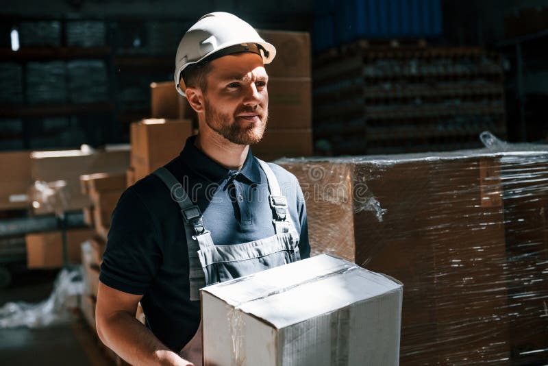 Top View of Employee in Uniform that is Working in the Storage at ...