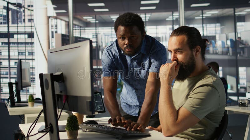 Employee Using Computer To Analyze Datasets, Being Assisted by Helpful ...
