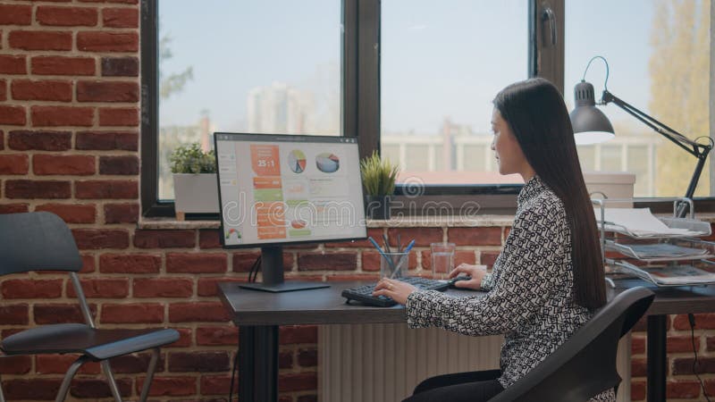 Employee Using Computer To Work on Startup Business Plan Stock Image ...