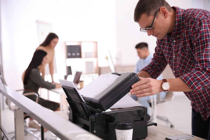 Employee Using New Modern Printer in Office Stock Photo - Image of ...