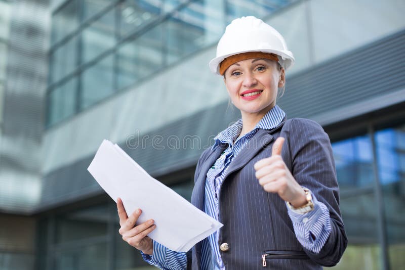 Employee Woman in Helmet with Paper Documents Stock Photo - Image of ...