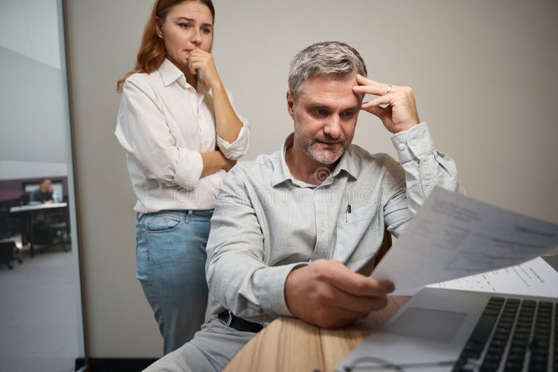 Employee Working in Office, Looking at Contract Stock Image - Image of ... Employee Working in Office, Looking at Contract Stock Image - Image of ...