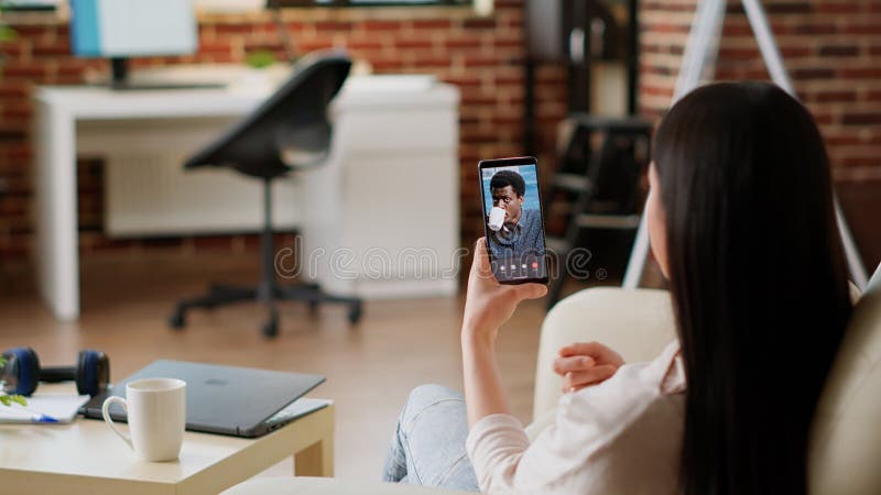 Employee Working Remotely from Home while Using Talking with Coworker ...