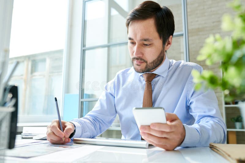 Employee Working with Smartphone in Office Stock Photo - Image of busy ...