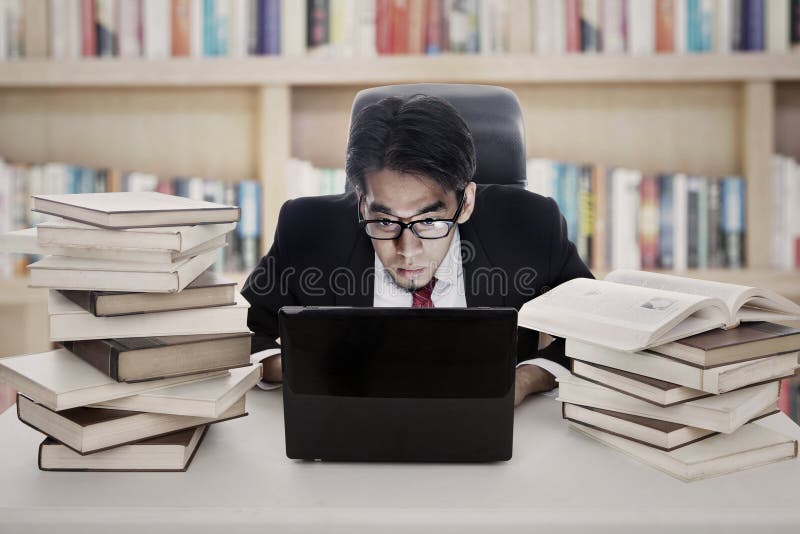 Employee works in library stock photo. Image of library - 26464662