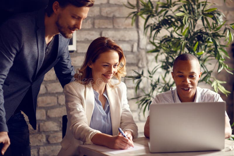 Employees with African Male Supervisor Working in Office Stock Photo ...