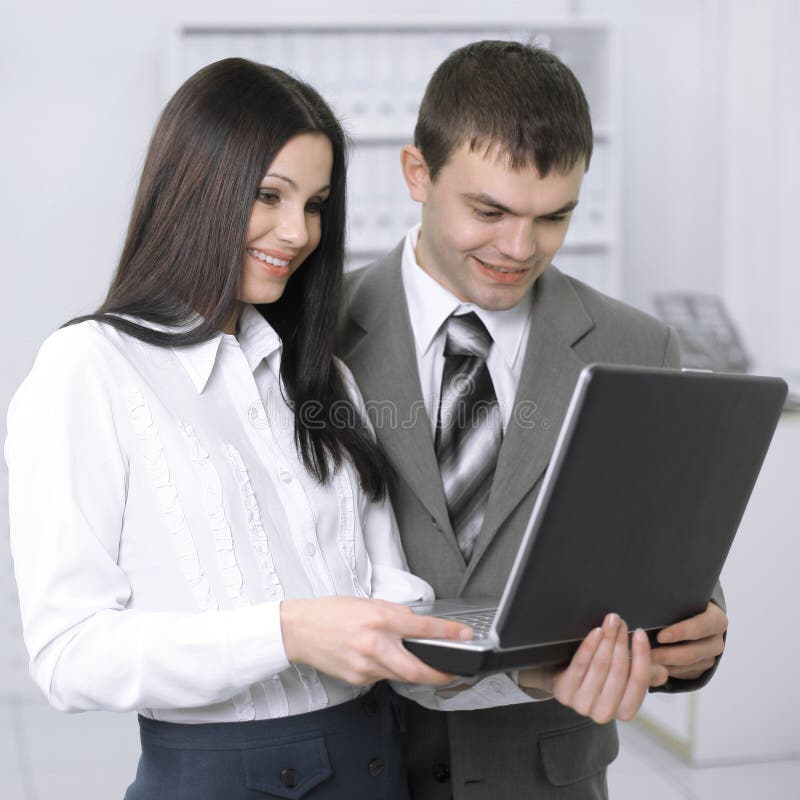 Employees Communicating on the Internet Using Laptop. Stock Photo ...