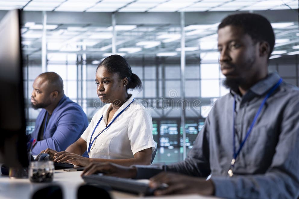 Employees in Data Center Deploying and Error Checking Utilities on Computer Stock Photo - Image ...
