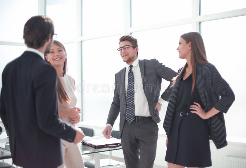 Employees Discuss Something Standing in the Office Stock Photo - Image ...