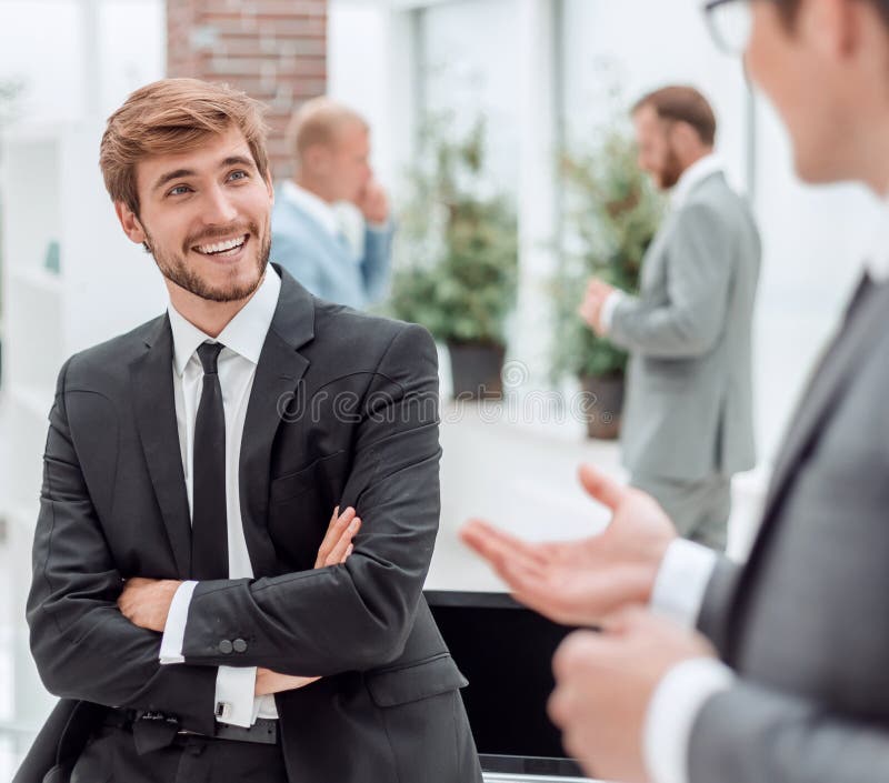 Employees Discuss Their Ideas Standing in the Office Lobby Stock Image ...