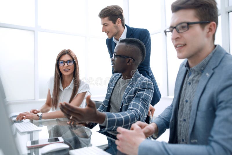 Employees Discussing New Ideas Sitting at the Desk Stock Photo - Image ...