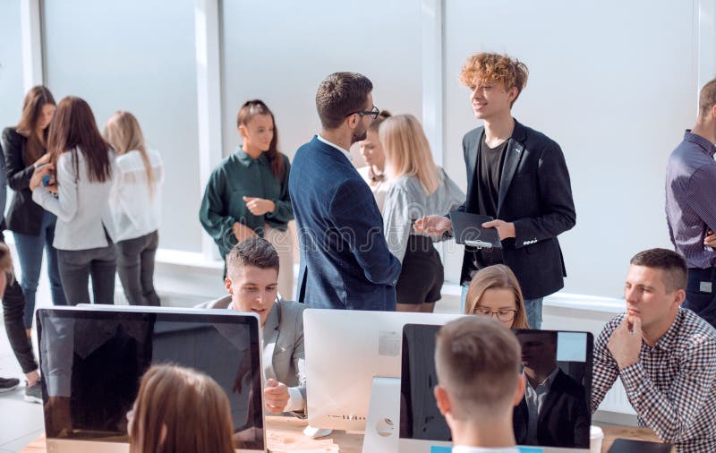 Employees Discussing Work Issues in the Office Stock Photo - Image of ...