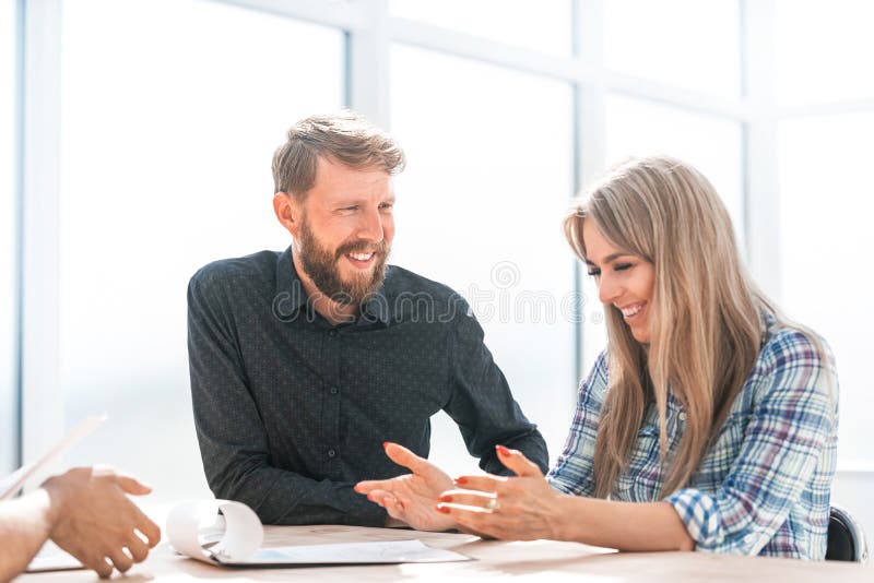 Employees Discussing Working Documents Sitting at the Table Stock Image ...