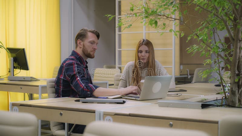 Employees Drinking Coffee and Talking in the Workplace. Stock Image ...