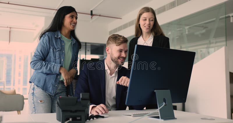 Employees Look at PC Screen, Talking, Collaborate on Joint Project ...