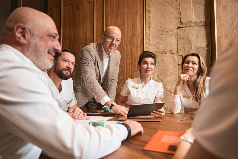 Employees of Modern Clinic Discuss Working Issues in Friendly ...