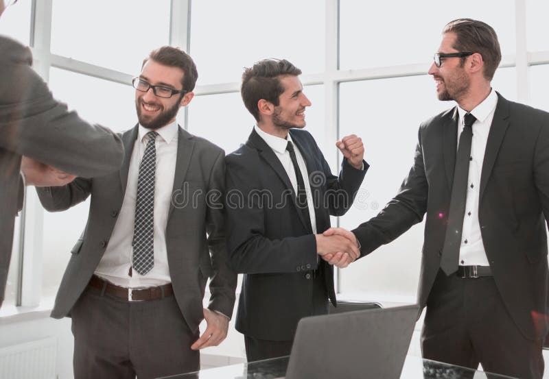 Employees Shaking Hands with Each Other when Meeting at the Office ...