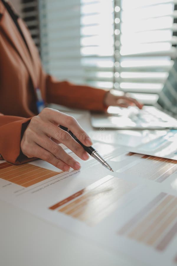 Employees Sit in an Office with a Pile of Documents that Need To Be ...