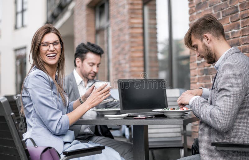 Employees Sitting at a Table in a Cafe Stock Photo - Image of ...