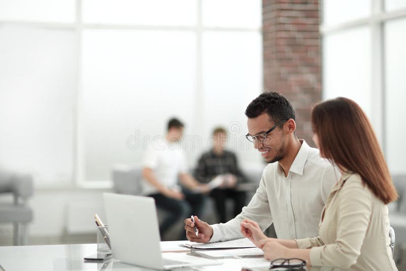 Employees Sitting at a Table in the Office . Stock Photo - Image of ...