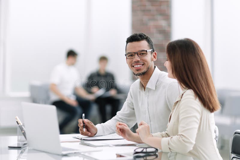 Employees Sitting at a Table in the Office . Stock Image - Image of ...
