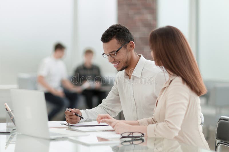 Employees Sitting at a Table in the Office . Stock Photo - Image of ...