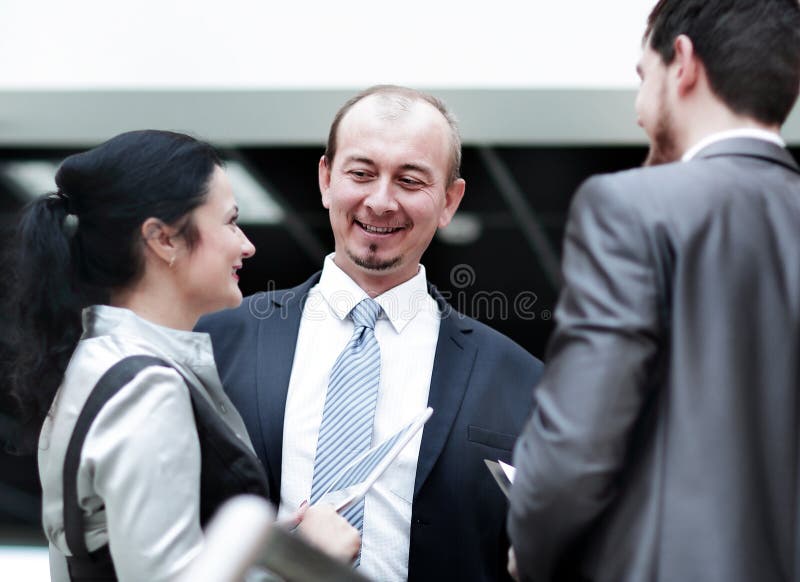 Employees Talking To a Customer Sitting at the Desk Stock Image - Image ...