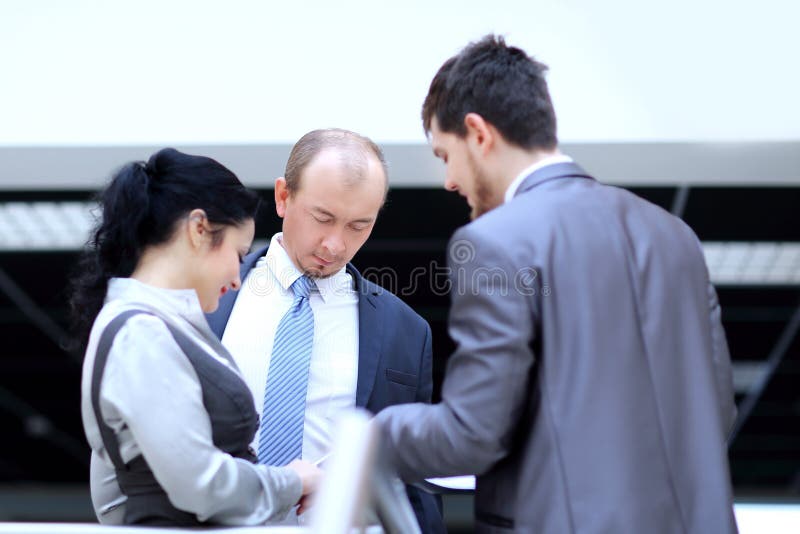 Employees Talking To a Customer Sitting at the Desk Stock Image - Image ...