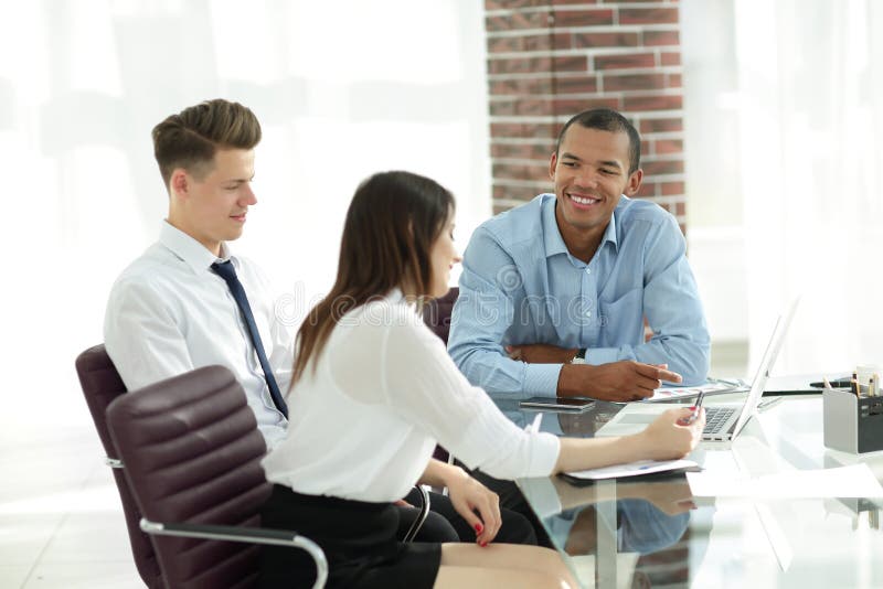 Employees Talking To a Customer Sitting at the Desk Stock Image - Image ...