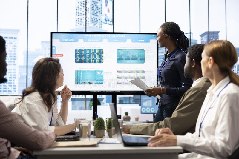 Employees Team Analyzing Infographics To Offer Solutions for the New ...