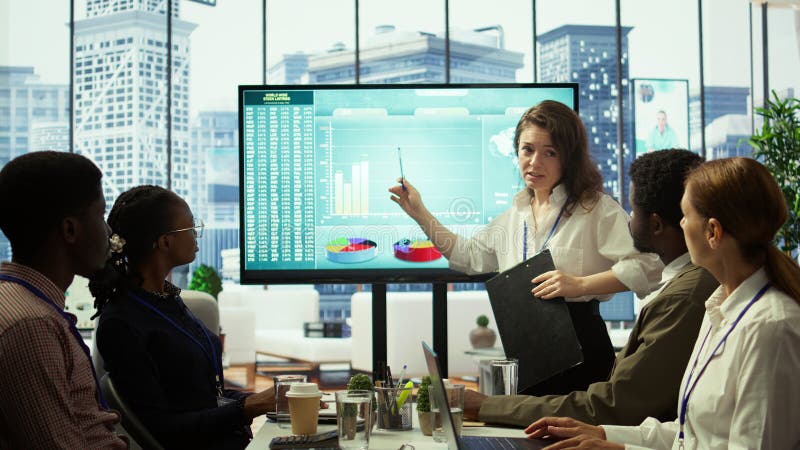 Employees Team Analyzing Infographics To Offer Solutions for the New ...