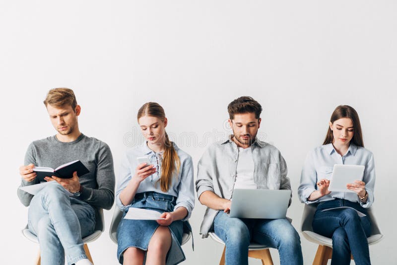 Employees Using Digital Devices while Waiting for Job Interview Stock ...