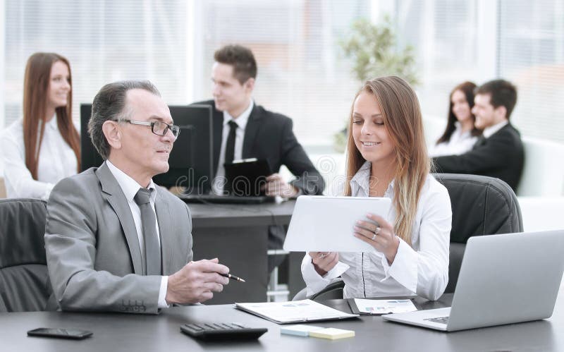 Employees Using Digital Tablet To Work with Financial Data Stock Image ...