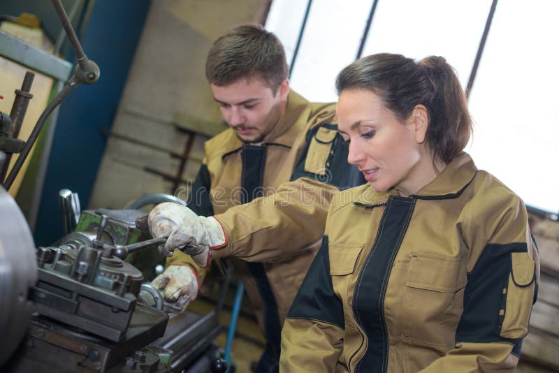 Employees Using Industrial Machinery at Factory Stock Image - Image of ...