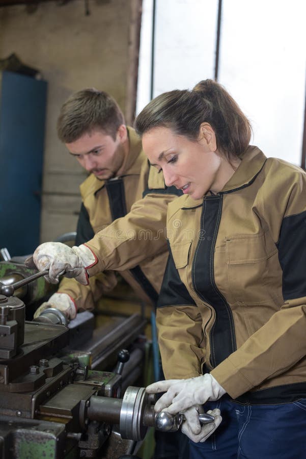 Employees Using Industrial Machinery at Factory Stock Image - Image of ...