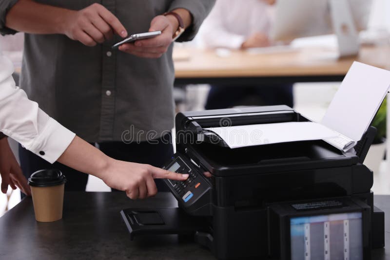 Employees Using Modern Printer in Office, Closeup Stock Image - Image ...