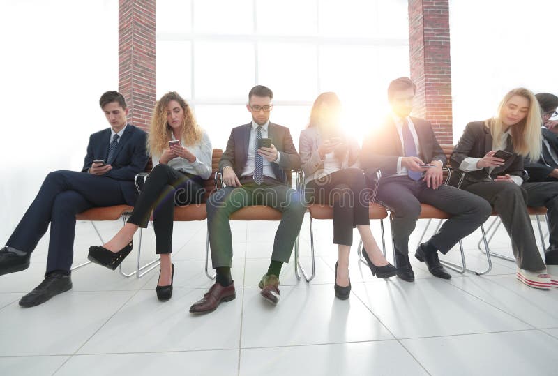 Employees Using Smartphones in the Office. Stock Image - Image of ...
