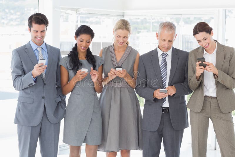 Employees Using Their Mobile Phone Stock Photo - Image of businesswoman ...