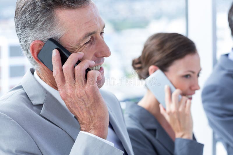 Employees Using Their Mobile Phone Stock Image - Image of happy, female ...