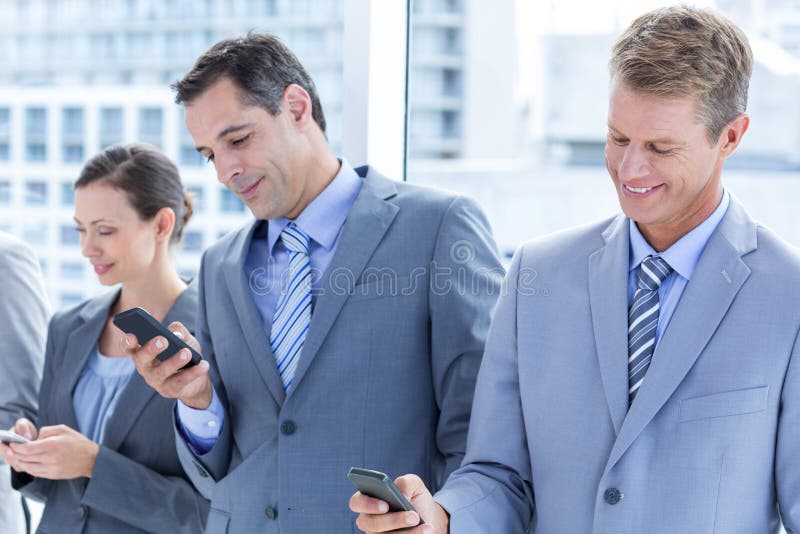 Employees Using Their Mobile Phone Stock Image - Image of female ...