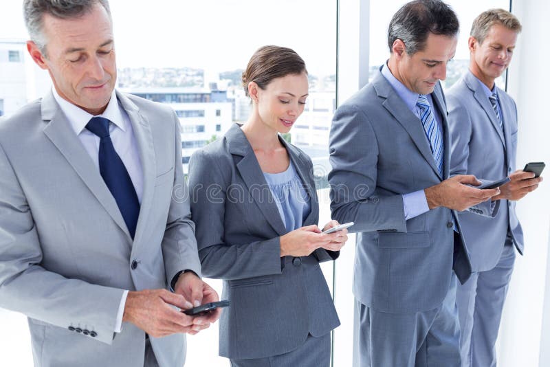 Employees Using Their Mobile Phone Stock Image - Image of people ...