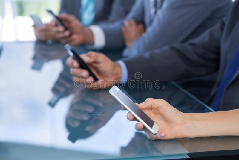 Employees Using Their Mobile Phone Stock Photo - Image of businesswoman ...