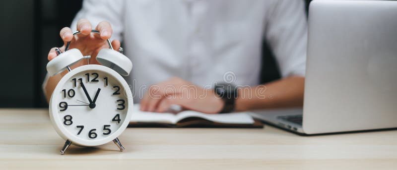 Employees Work Overtime until Late and Put Their Hands on the Clock ...