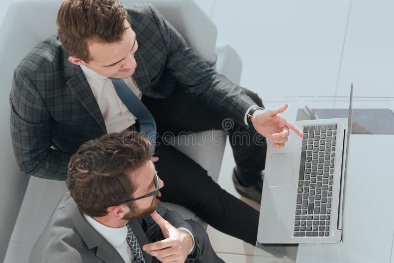 Employees Working with a Laptop Stock Photo - Image of discussion ...