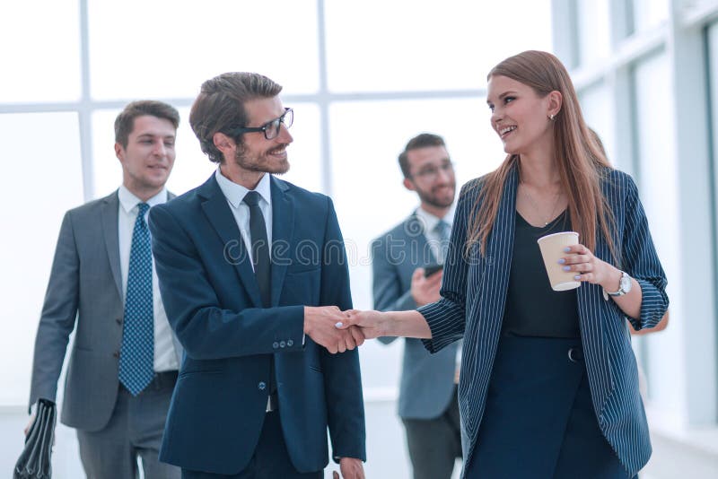 Employer Shaking Hands with a Young Employee. Stock Image - Image of ...