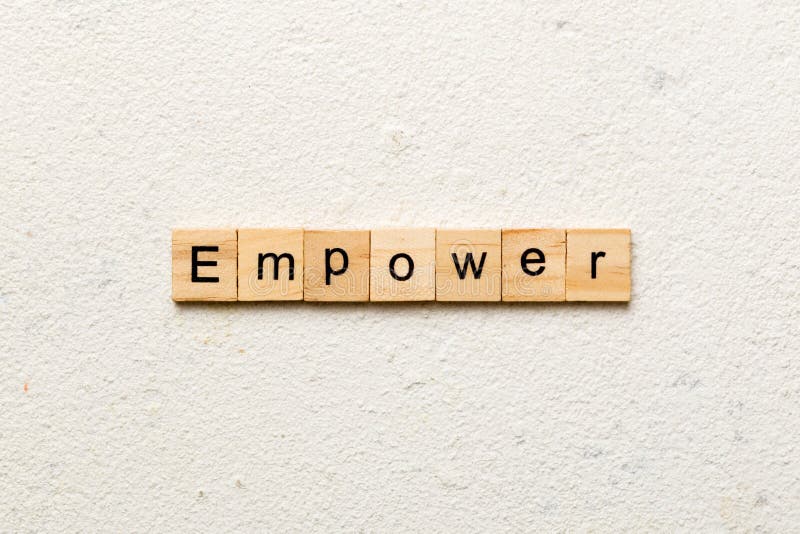 Empower Word Written on Wood Block. Empower Text on Table, Concept ...