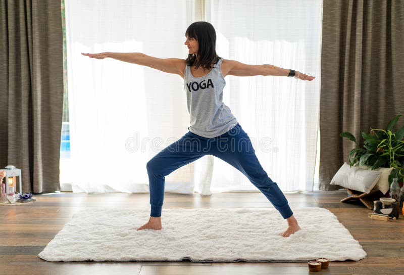Empowered Yoga Instructor Showcasing the Powerful Warrior II Pose Stock ...