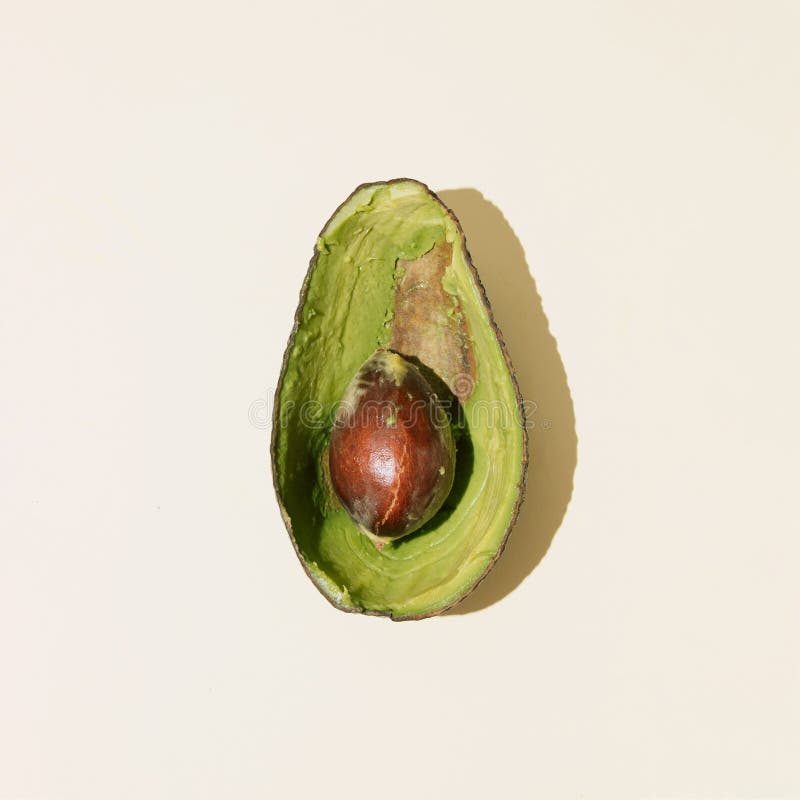 Emptied Shell of an Avocado and Seed Avocado with Copy Space on Beige ...